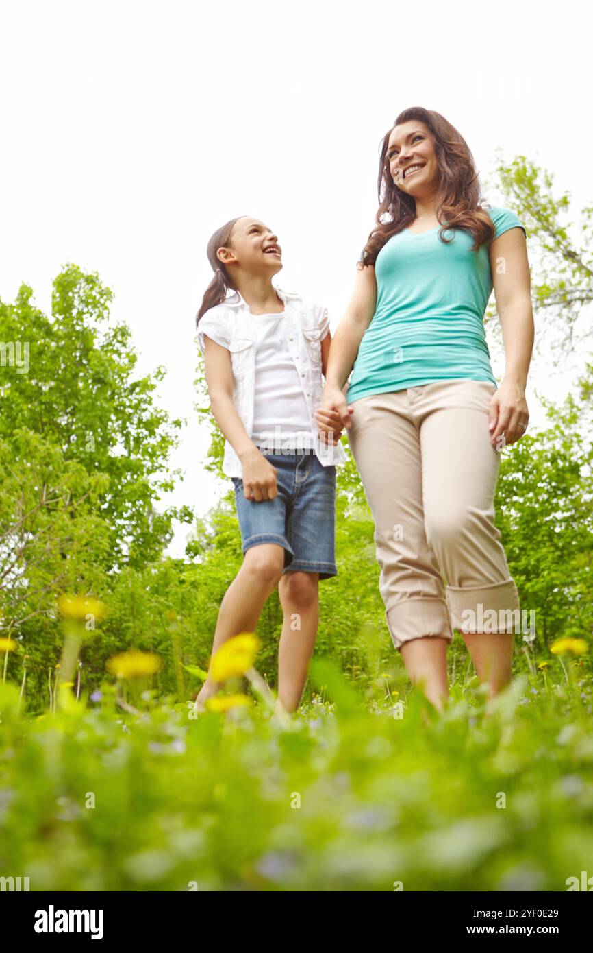 Mother, girl and laughing in nature, holding hands and outdoor for ...