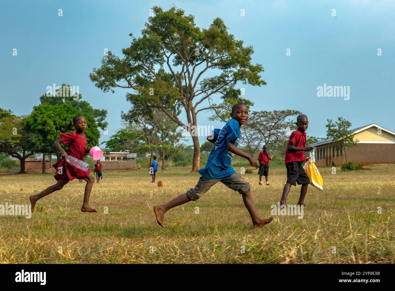 School children running out of their school on their way back home ...