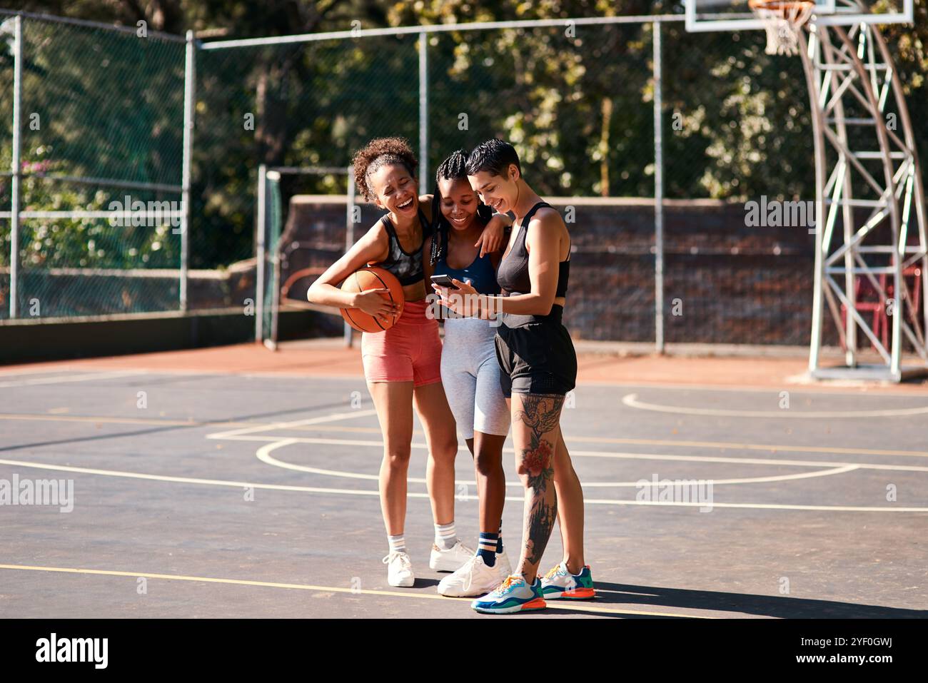 Basketball, friends and girls laughing with phone for sports meme ...