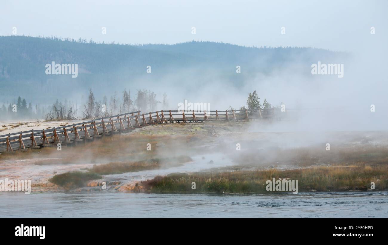 Yellowstone Geyser Basin Boardwalk with Steam and River Water Volcanic ...