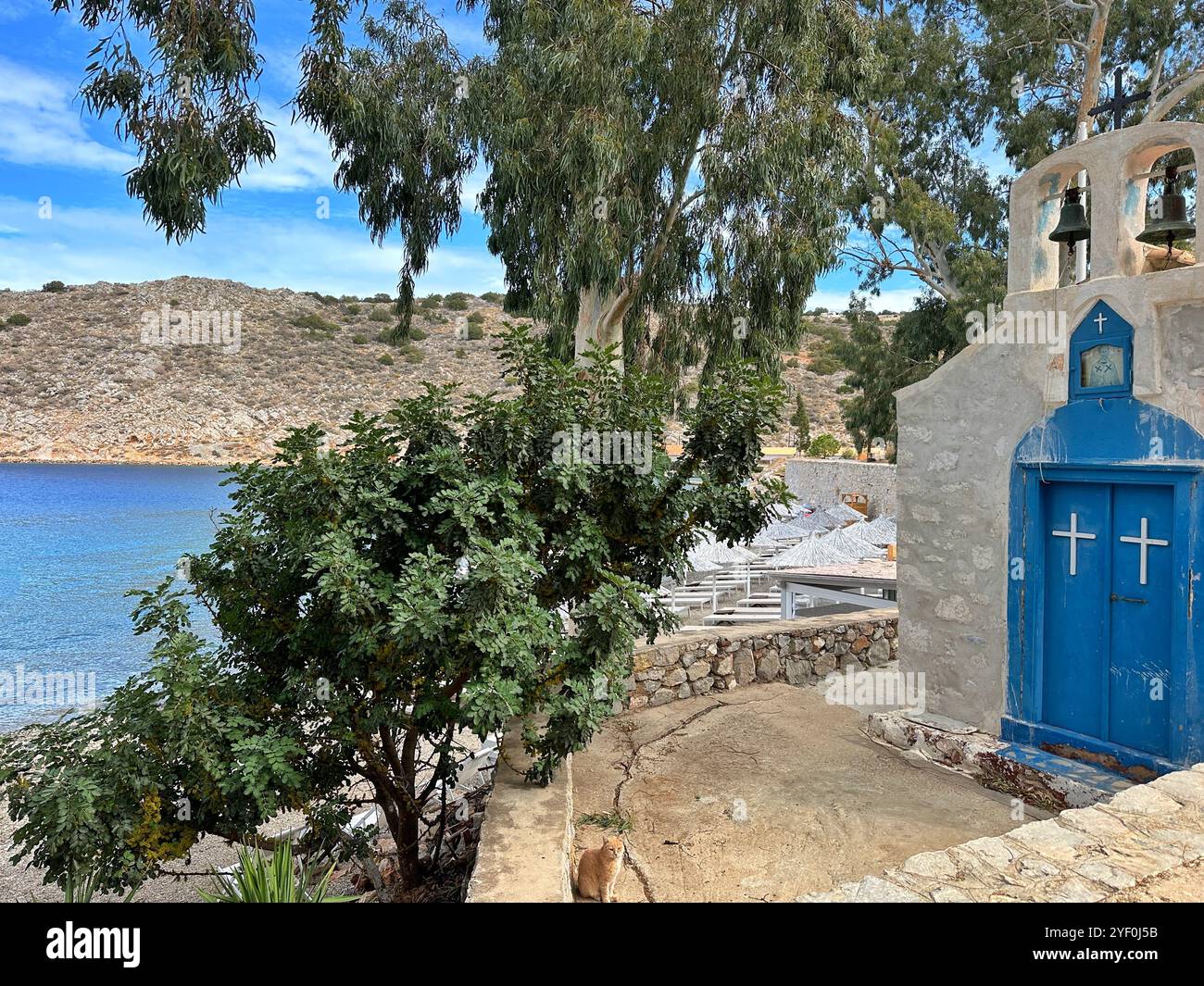 Local church on waterfront, Mandraki Bay, Hydra, Saronic Gulf, Greece ...
