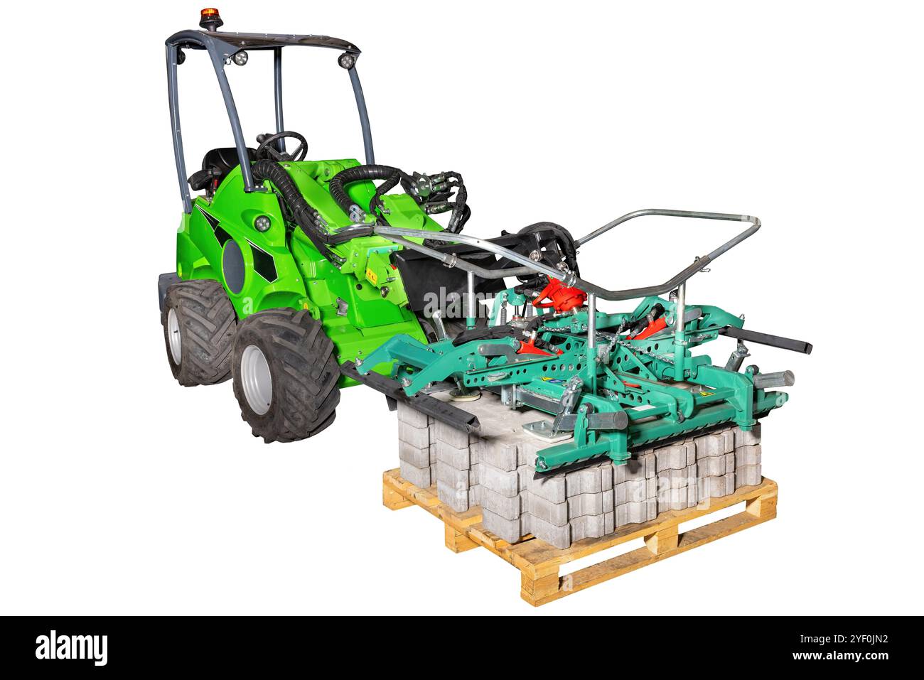 Powerful loader lifting heavy concrete blocks with industrial machine ...