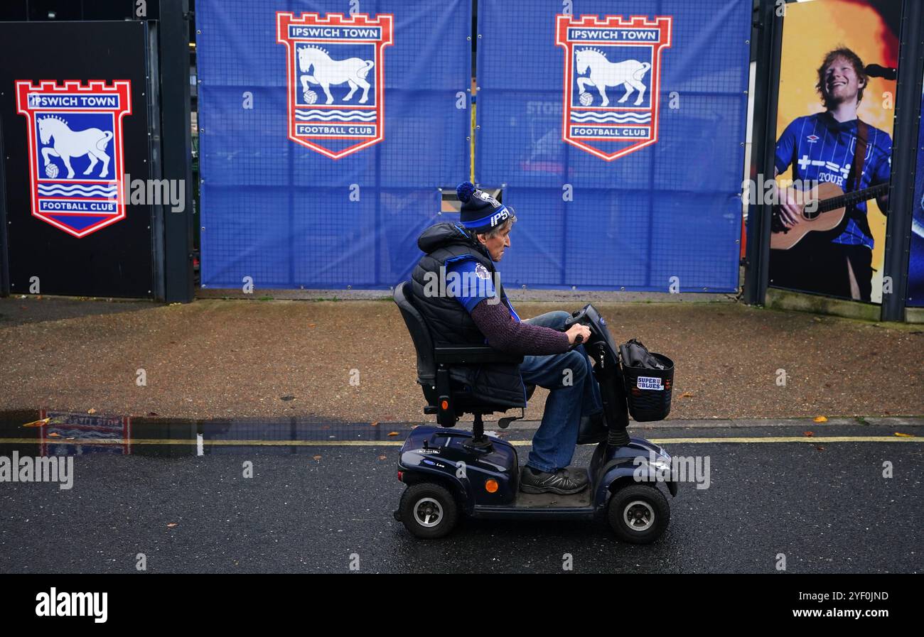An Ipswich fan outside the ground before the Premier League match at ...