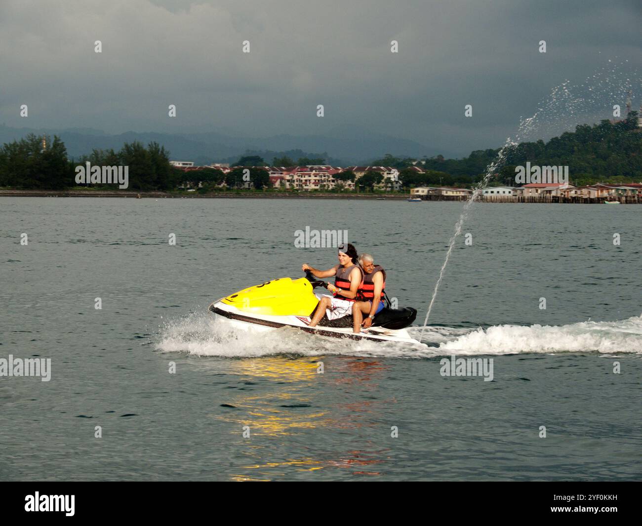 Father son riding jet ski hi-res stock photography and images - Alamy