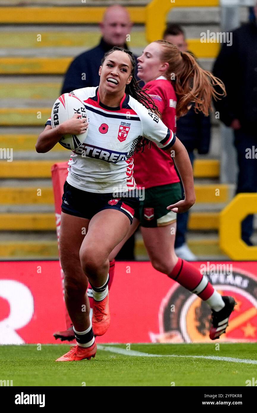 England's Amelia Brown goes over to score a try against Wales, during ...