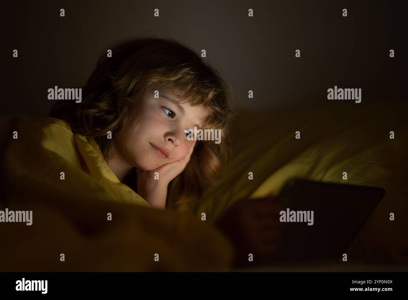 Kid is addicted to tablet, kid use tablet, watching cartoon. Child ...