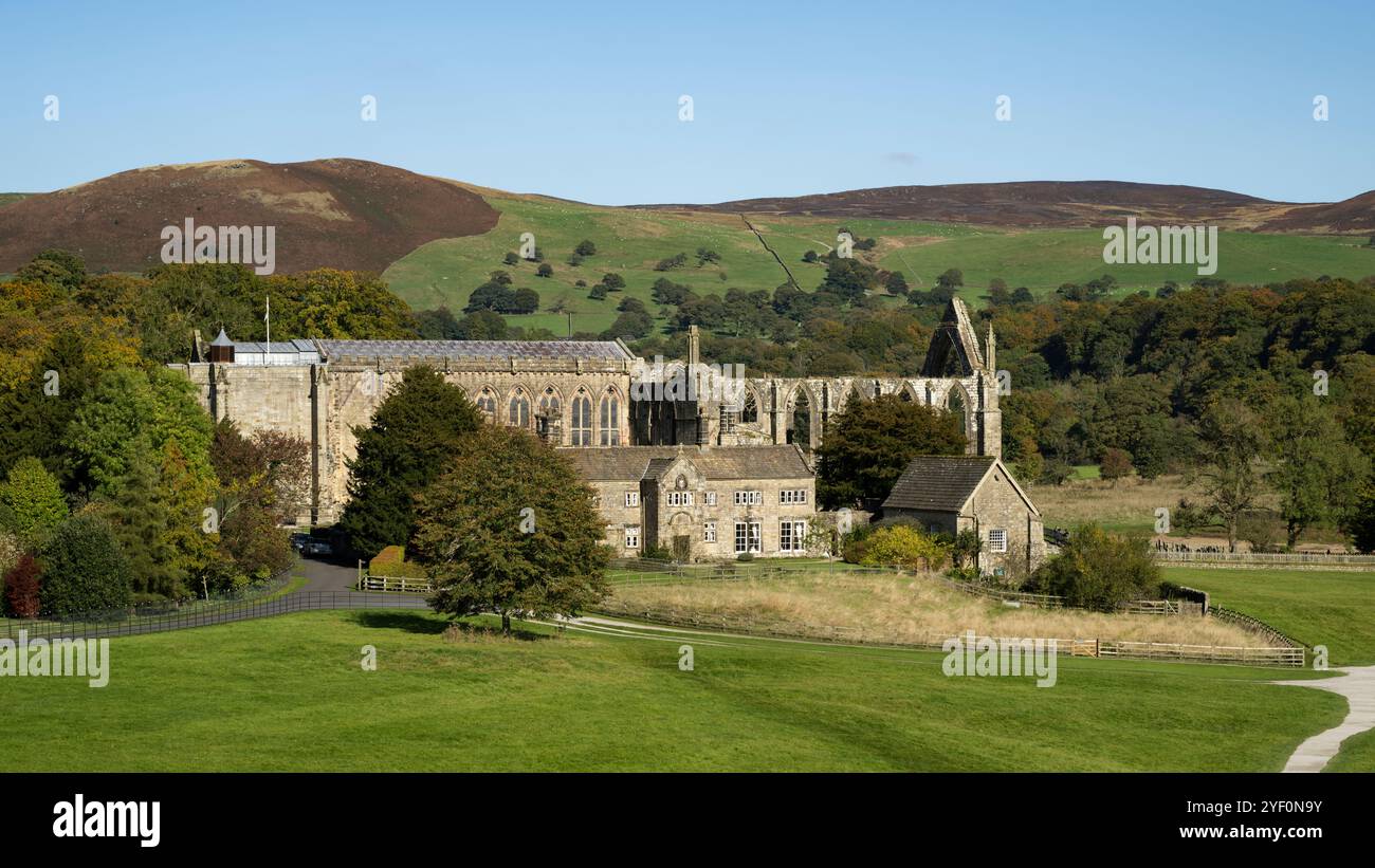 Scenic rural view over picturesque sunlit monastic Bolton Abbey ruins ...