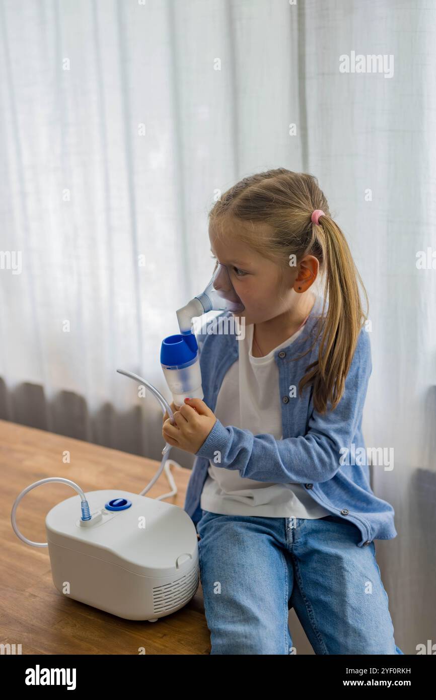 Kid breathing through nebulizer hi-res stock photography and images - Alamy