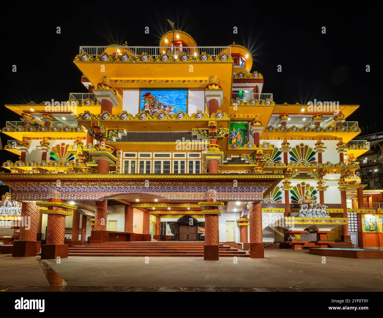 The Thakurbari Temple in Gangtok, Sikkim, India, beautifully illuminated at night, showcasing ...
