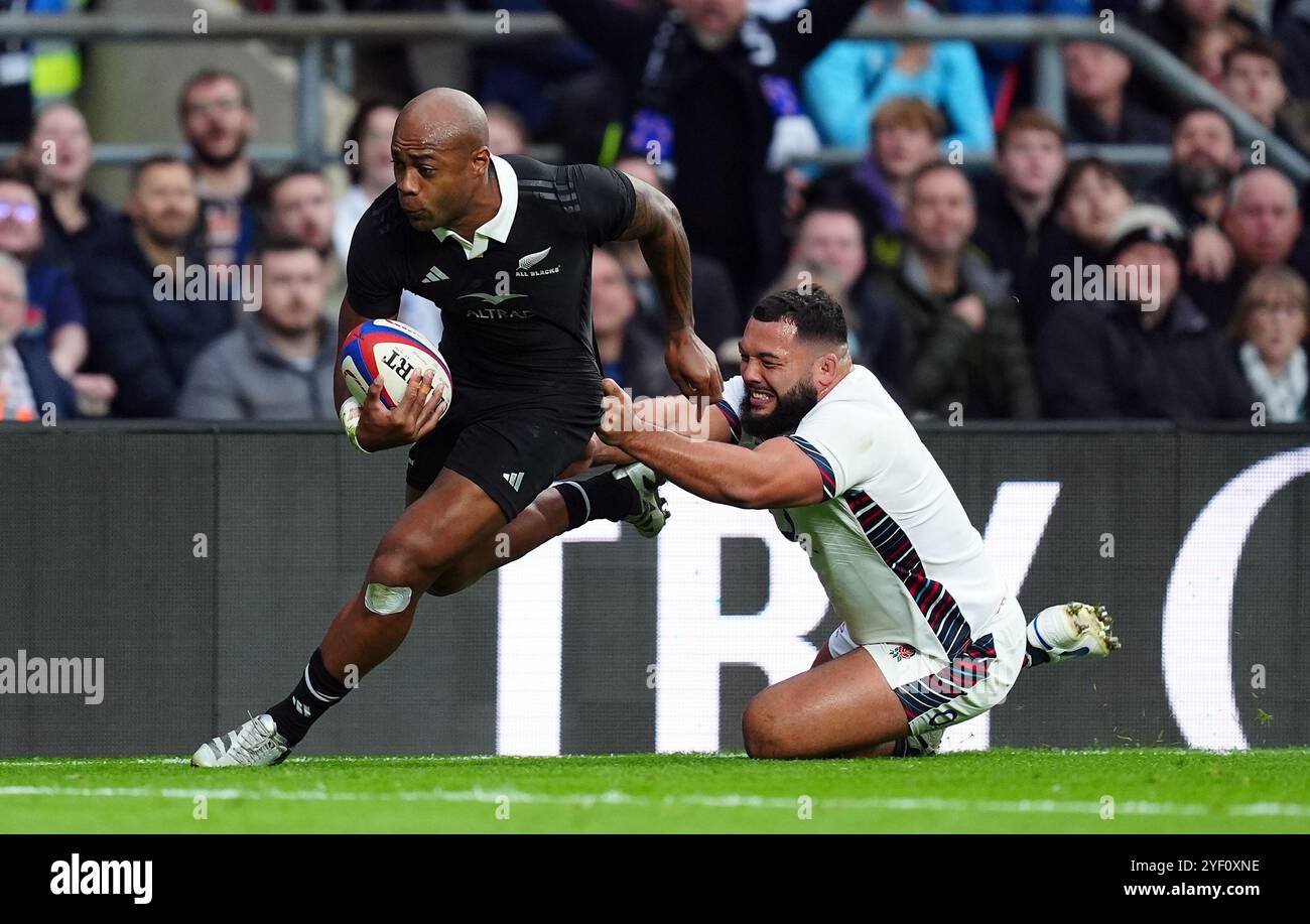 New Zealand's Mark Tele'a breaks clear to score their first try during ...