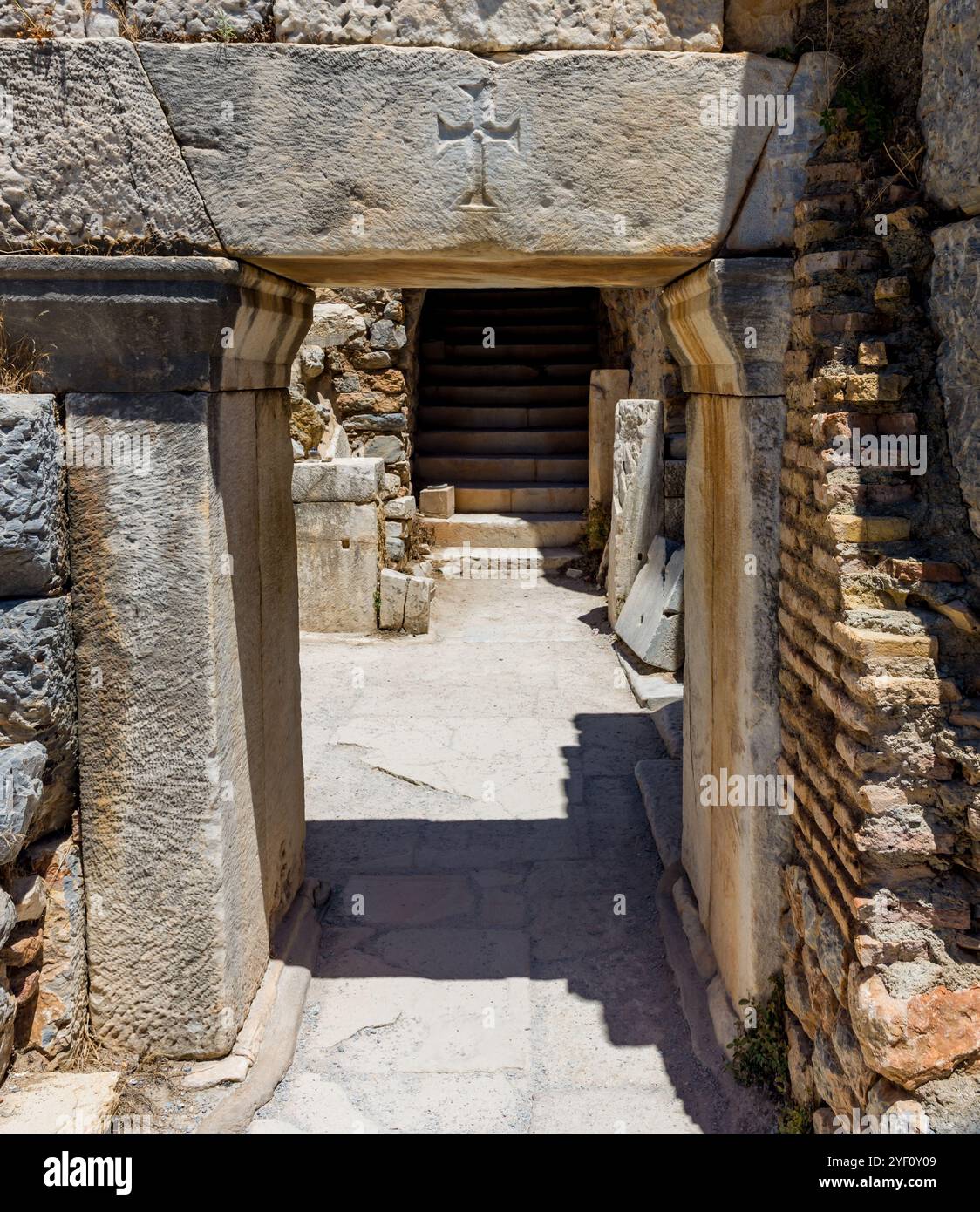 Cross above entrance in the Ancient Greek City Of Ephesus, Turkey Stock ...