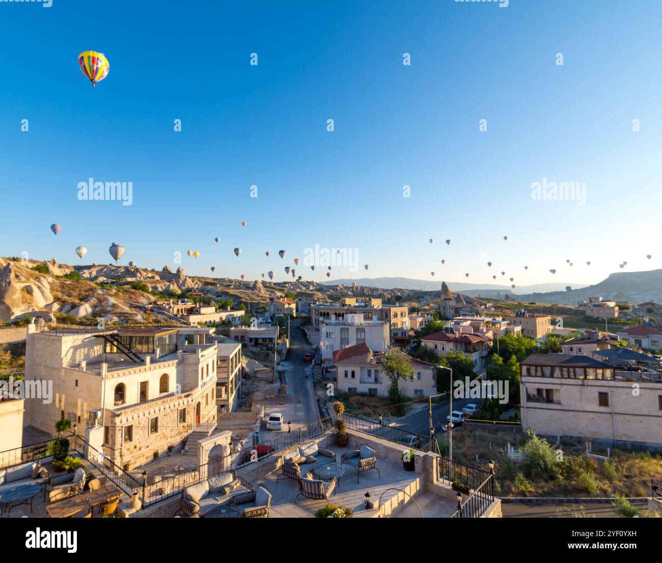 View of Hot Air Balloons at Sunrise from Hotel Terrace in Goreme in ...