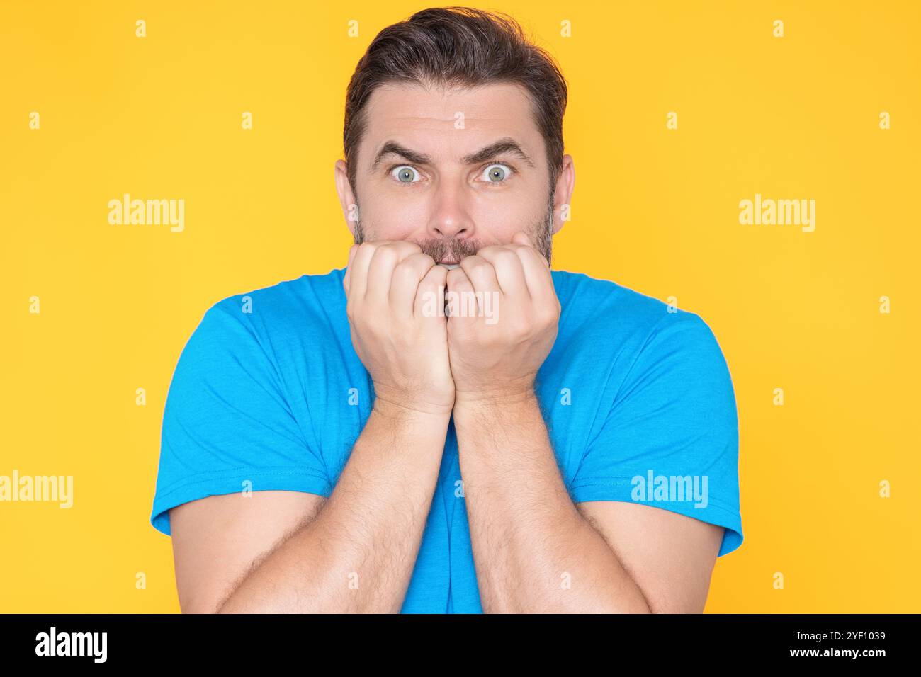 Portrait of shocked unshaven caucasian man afraid and shocked with ...