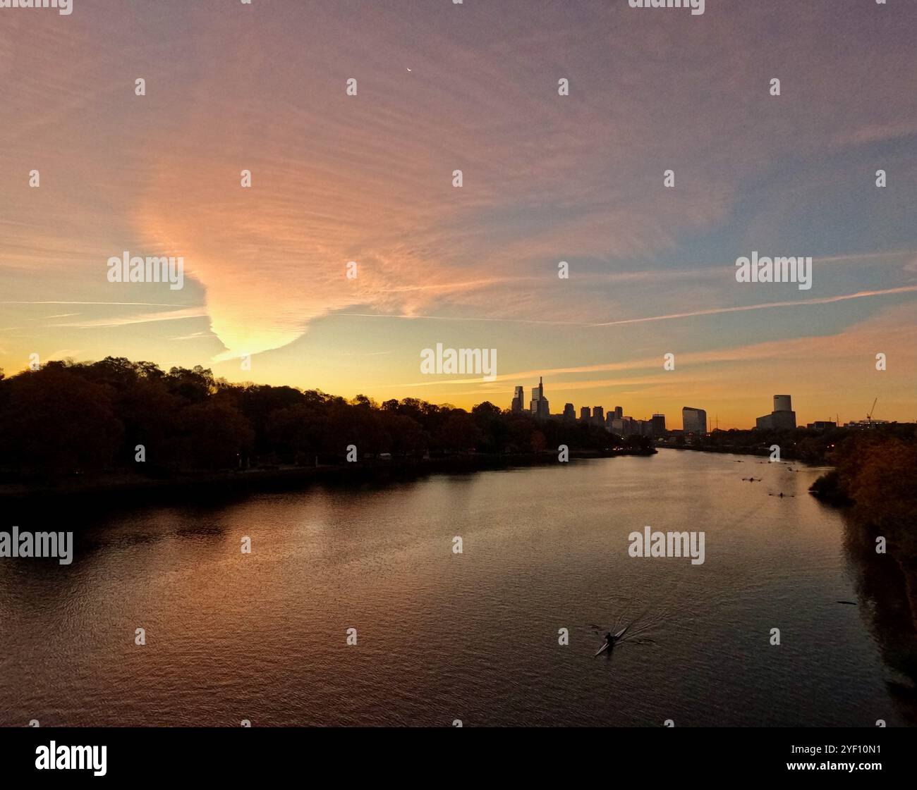 Rowers head north along the Schuylkill River with the Philadelphia ...