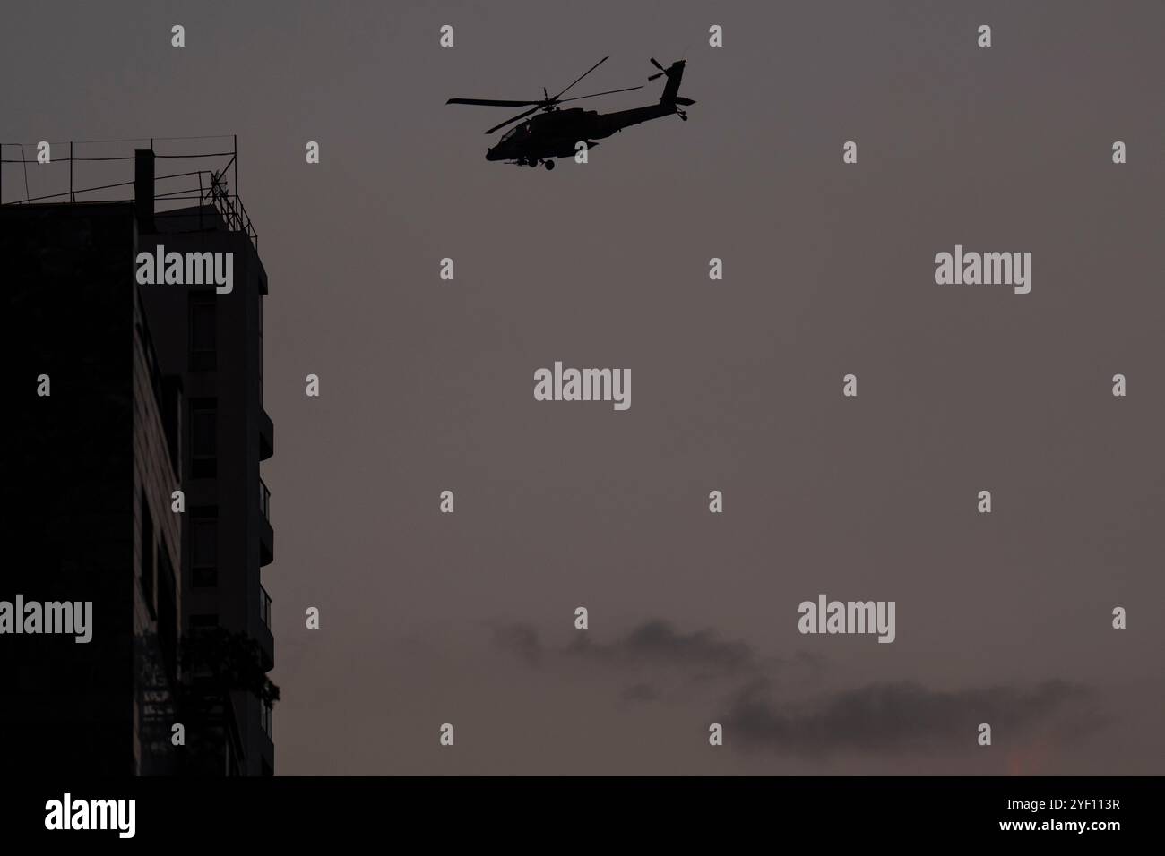An Israeli Apache helicopter scans the sky for drones after Lebanon's ...