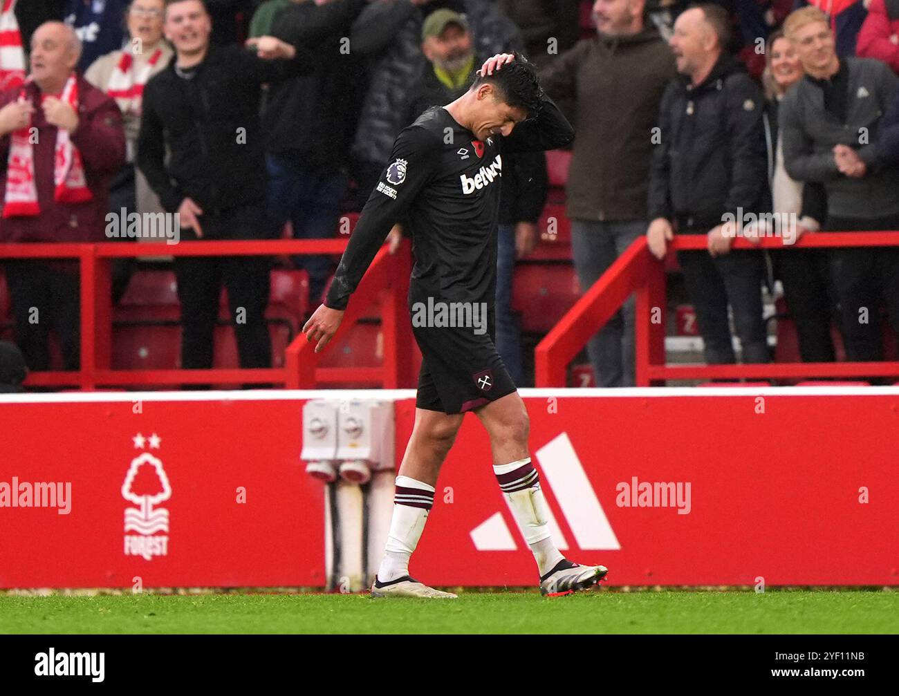 West Ham United's Edson Alvarez walks off the field after being shown a ...