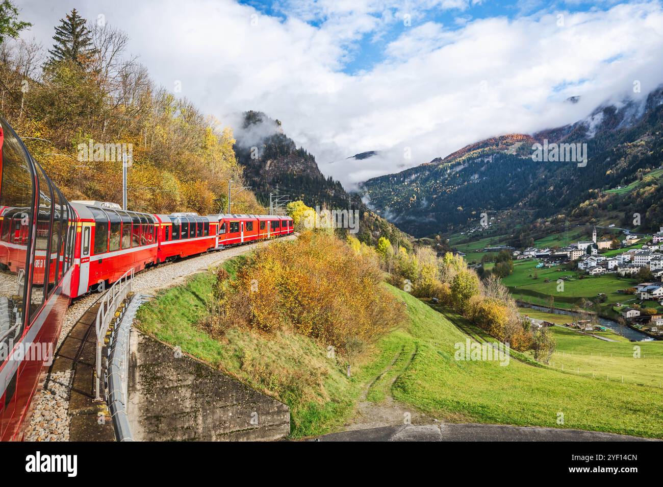 Red swiss train, Bernina Express, in Swiss Alps. Tirano to St. Moritz ...