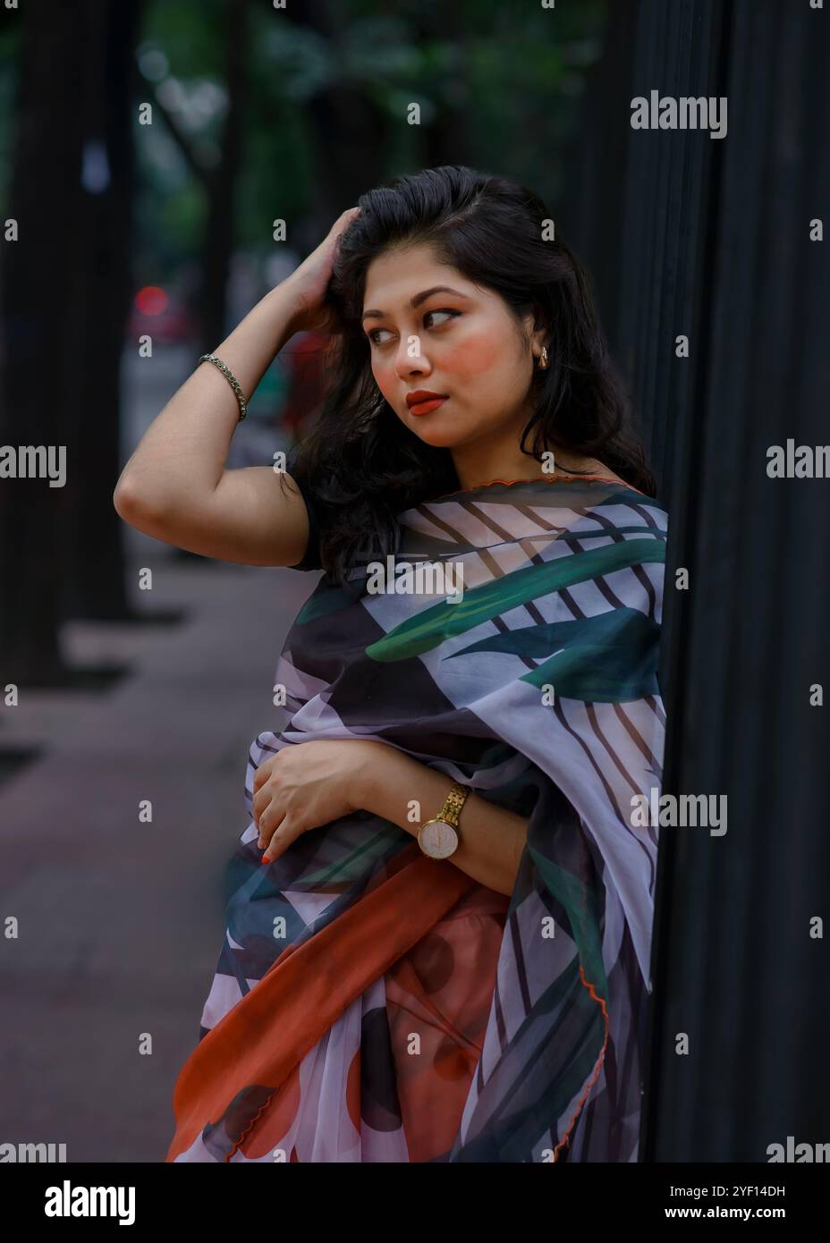 A lady wearing colourful floral saree Stock Photo - Alamy
