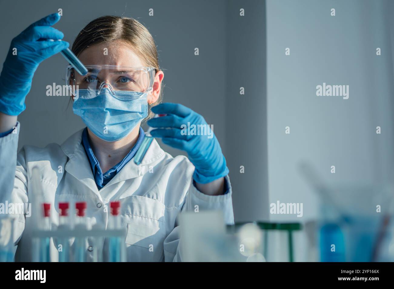 A dedicated scientist is conducting a detailed experiment within a ...