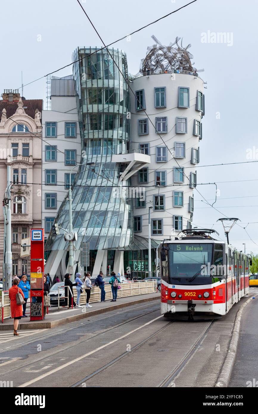 The iconic red tramway passing in front of the Dancing House, the ...