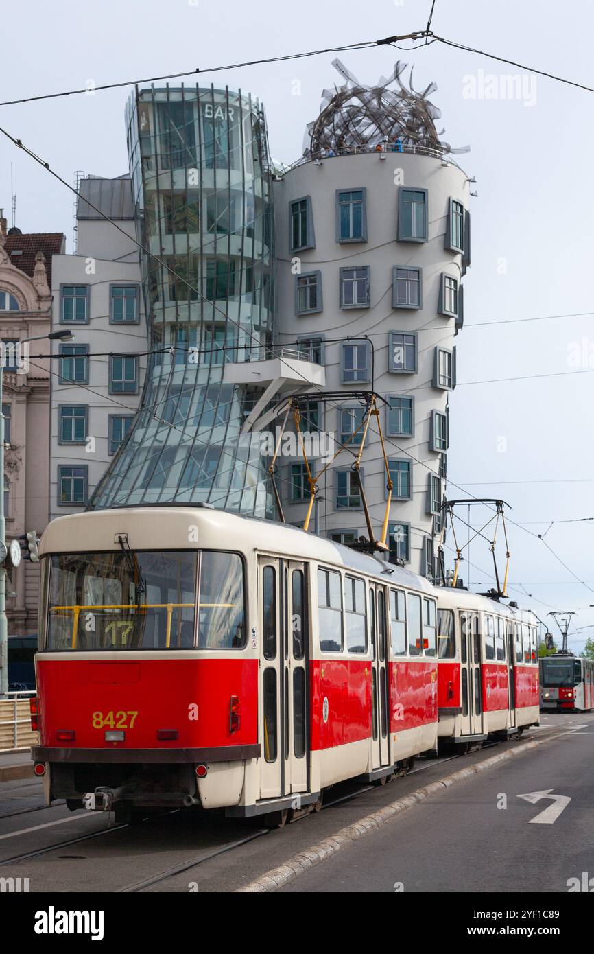 The iconic red tramway passing in front of the Dancing House, the ...