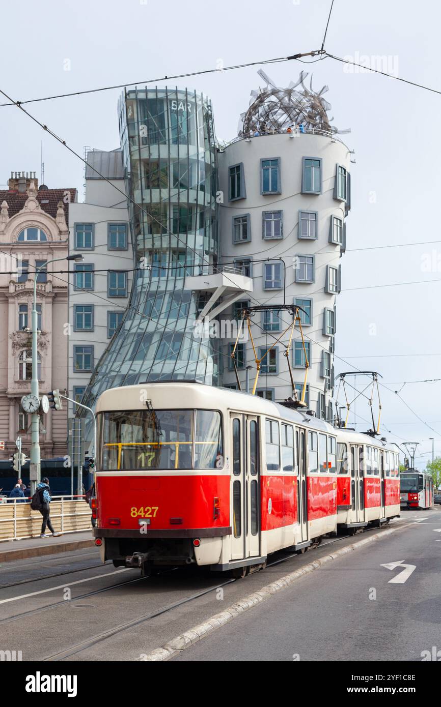 The iconic red tramway passing in front of the Dancing House, the ...
