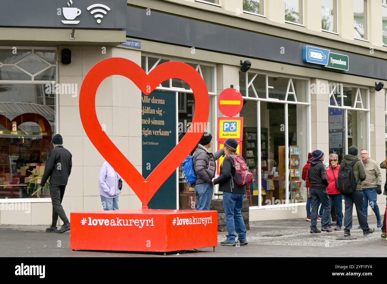 Akureyri, Iceland - 24 August 2024: People around a heart shaped Love ...