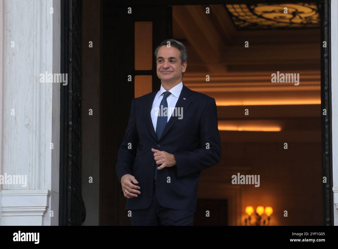 Greek Prime Minister Kyriakos Mitsotakis stands at Maximos Mansion in ...