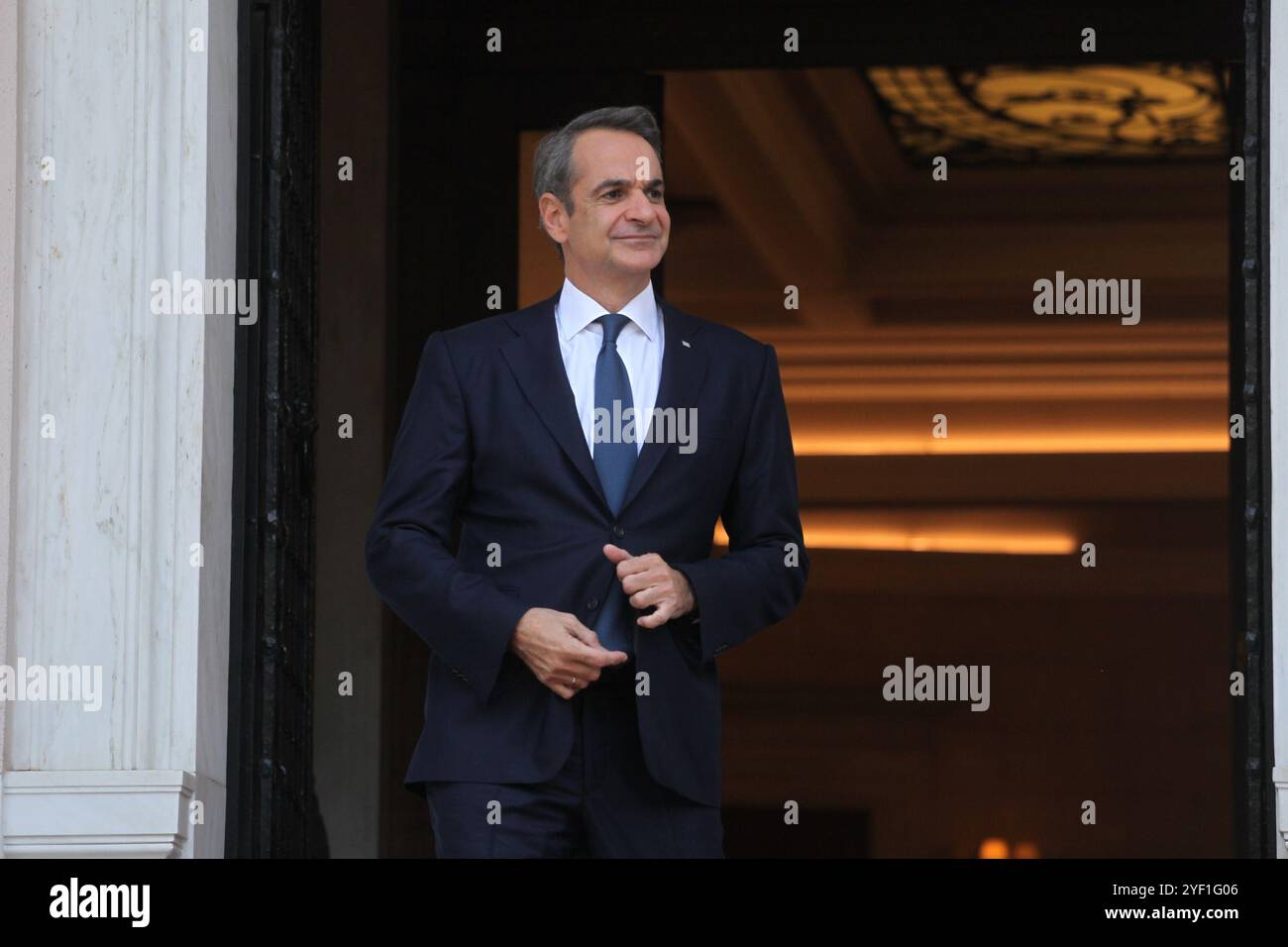 Greek Prime Minister Kyriakos Mitsotakis stands at Maximos Mansion in ...