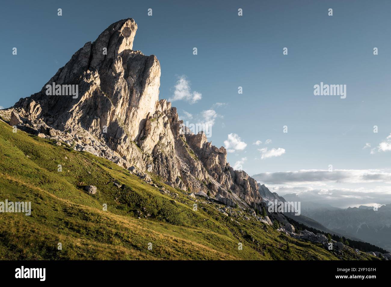 A beautiful mountain stands majestically with a vibrant blue sky ...