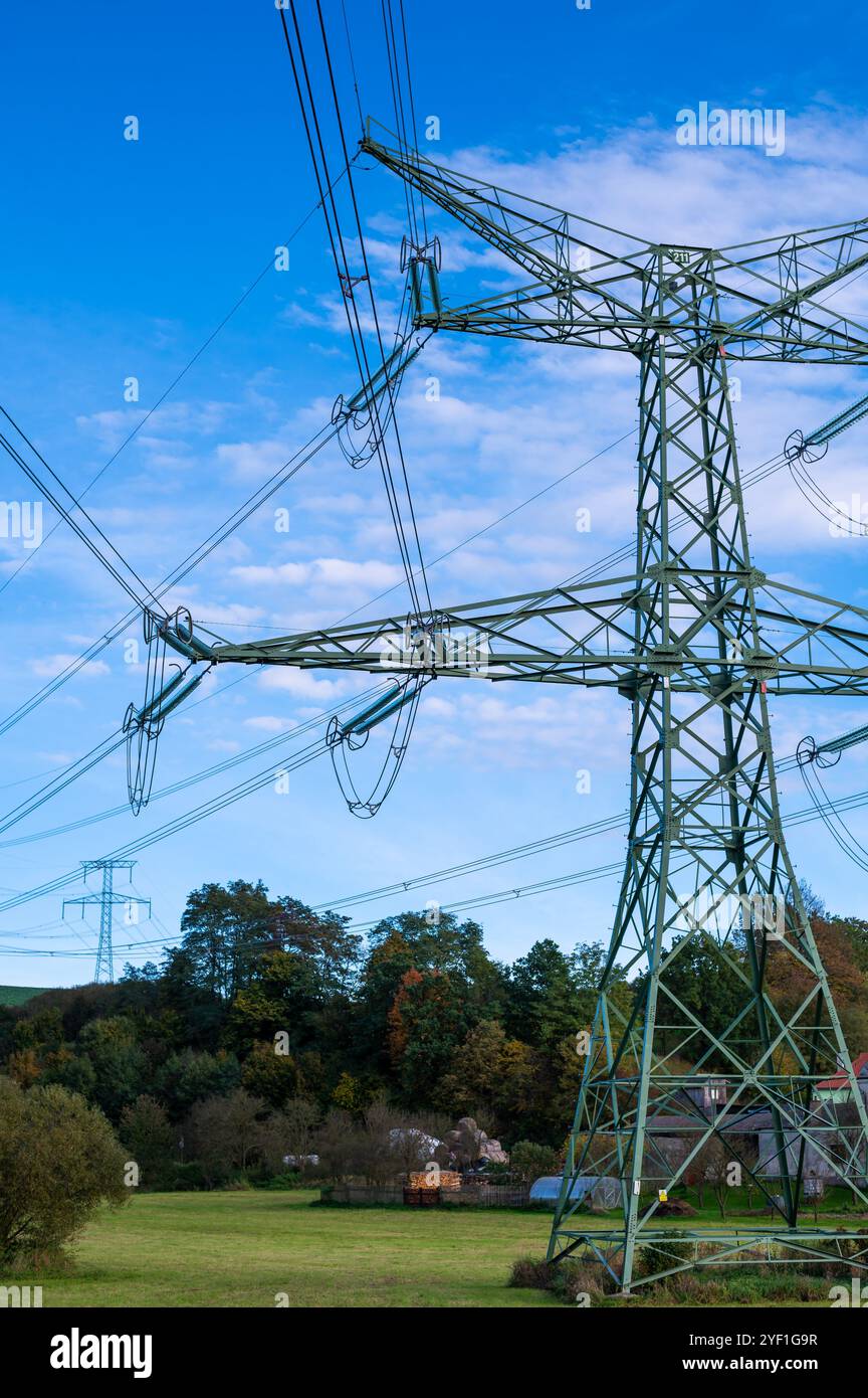 A landscape photo of power lines and transmission towers stretching ...
