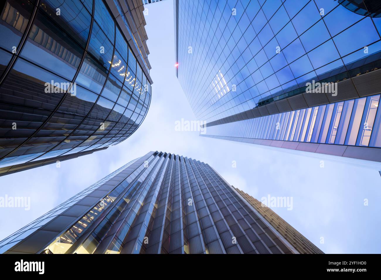 view of sky through the Gaps between densely built Skyscraper buildings ...