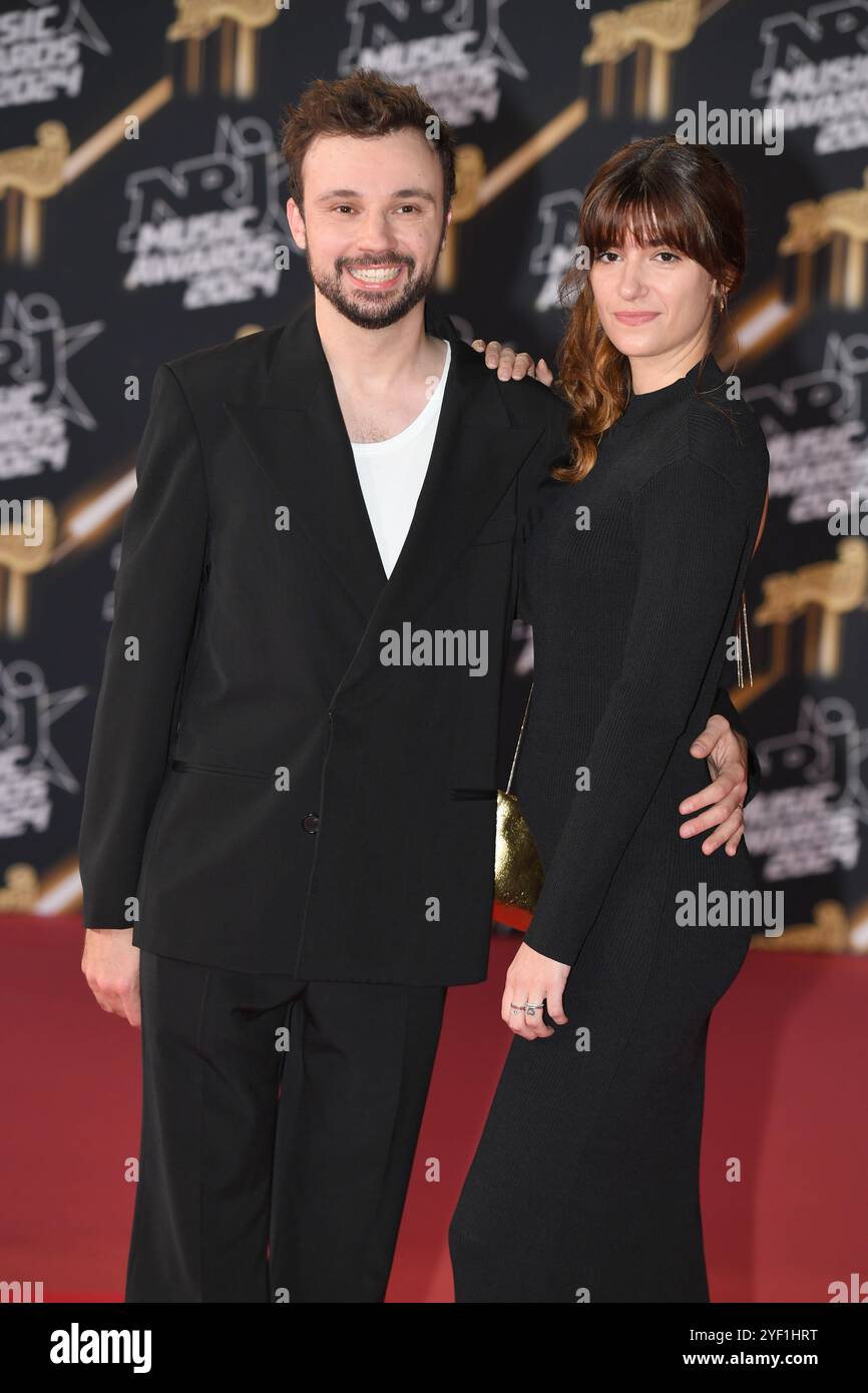 Tom Villa and Marion Dupont attend the 26th NRJ Music Awards 2024 Red Carpet arrivals at Palais ...