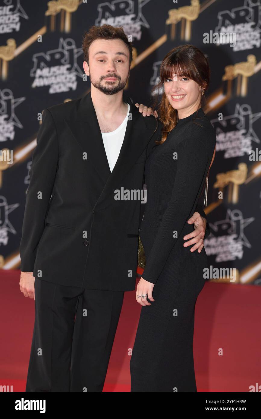 Tom Villa and Marion Dupont attend the 26th NRJ Music Awards 2024 Red Carpet arrivals at Palais ...