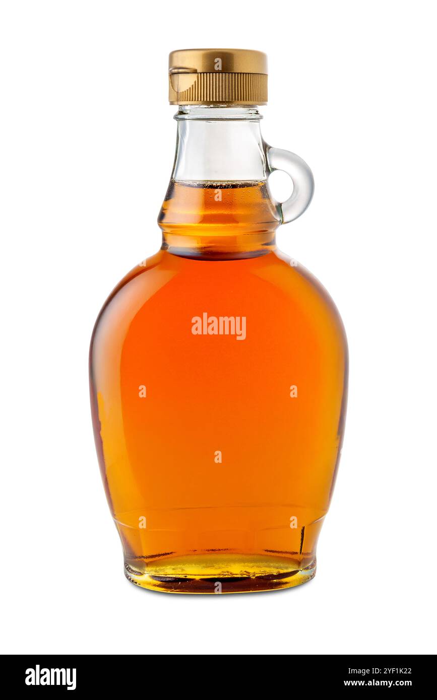 Maple syrup in glass cruet, typical Canadian sweet syrup, isolated on ...