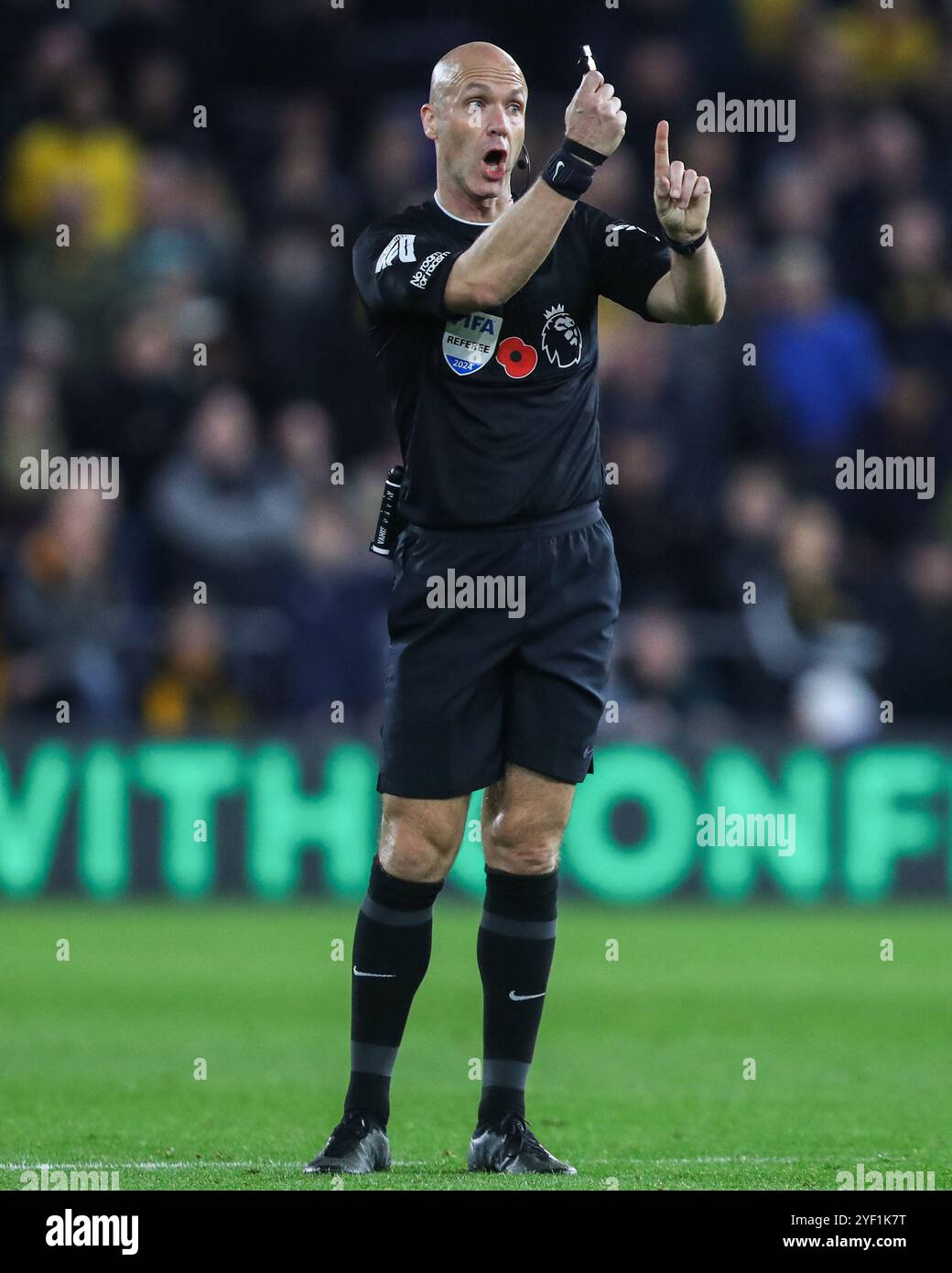 Referee Anthony Taylor signals during the Premier League match ...