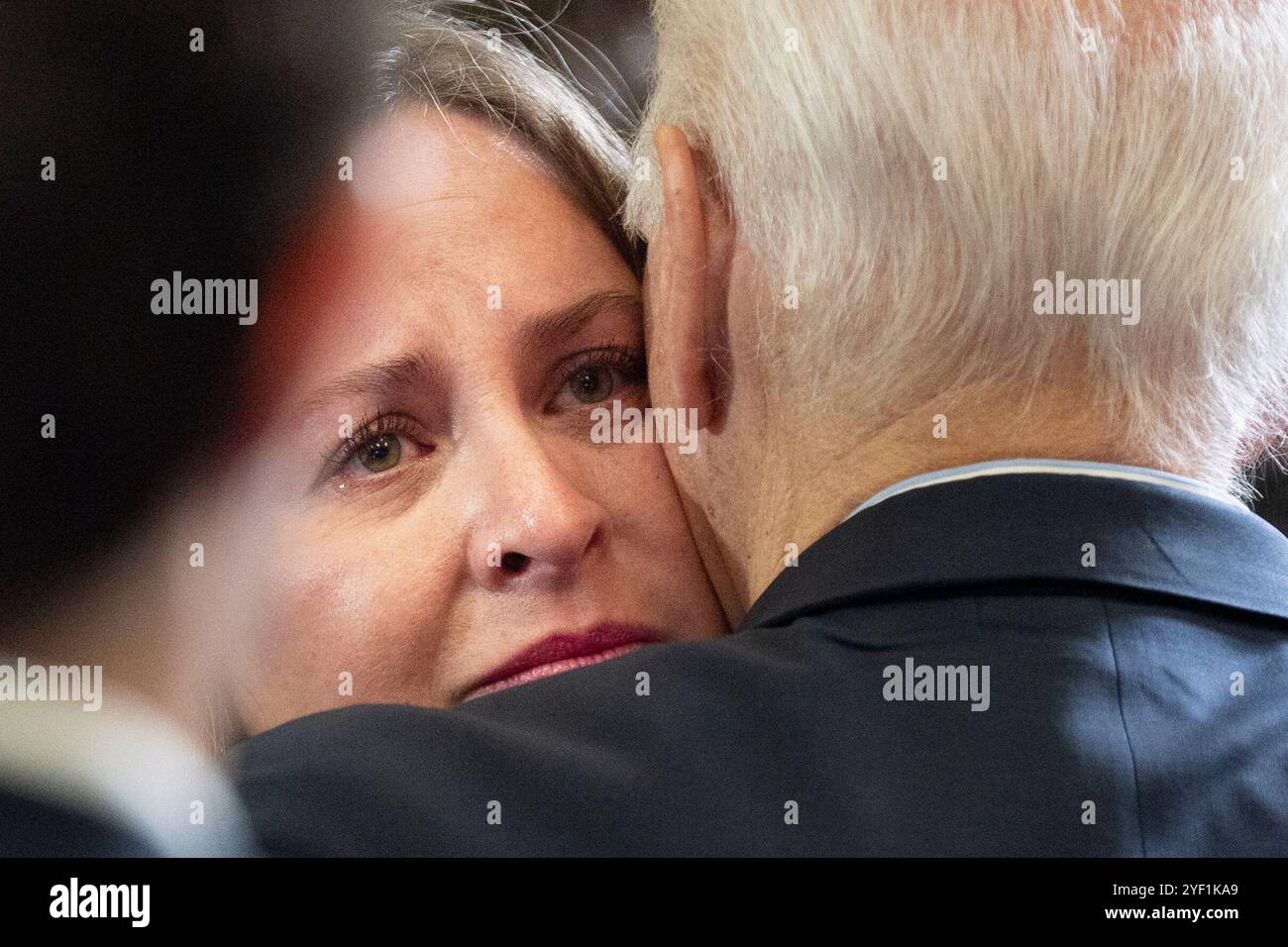 With a tear rolling down in the corner of her eye, President Joe Biden ...