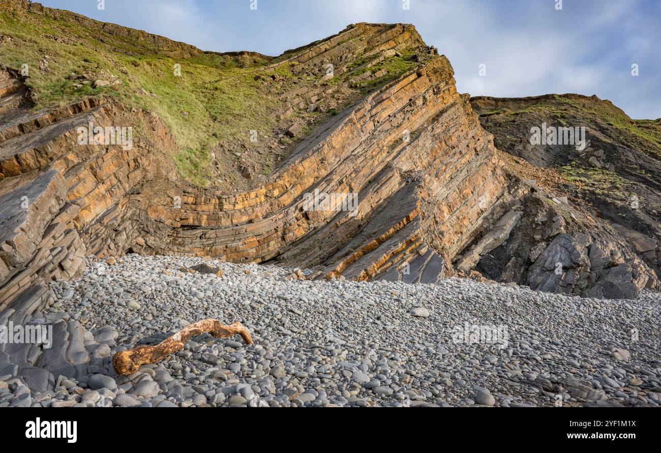 Golden cliffs at Sandymouth Cornwall lit by late November sunshine ...