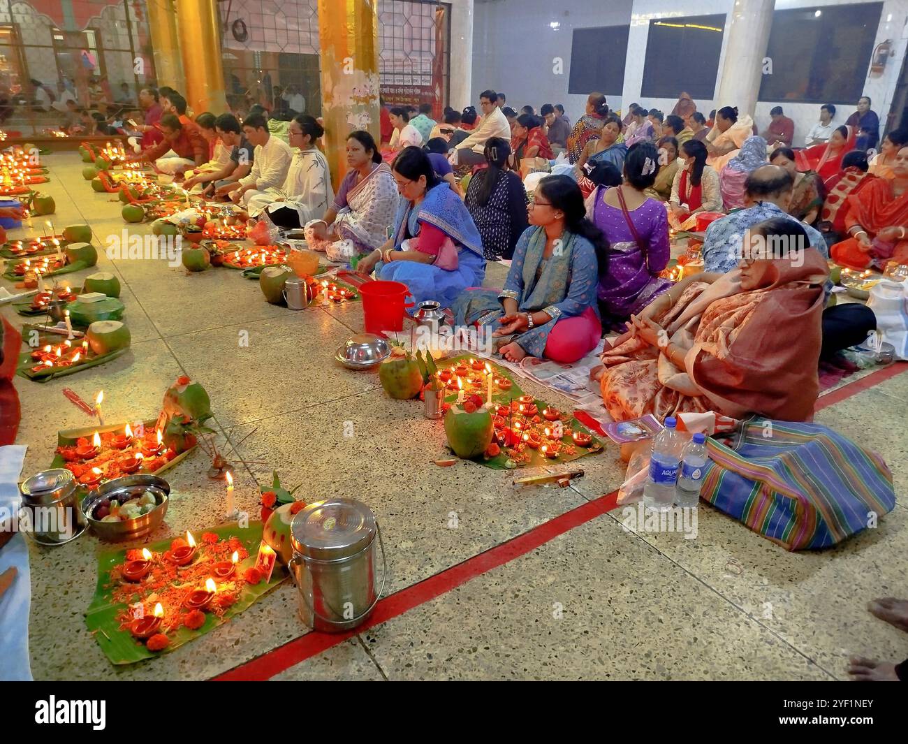 Dhaka, Bangladesh. 3rd Nov, 2024. Hindu devotees attend an earthen lamp light prayer session to ...