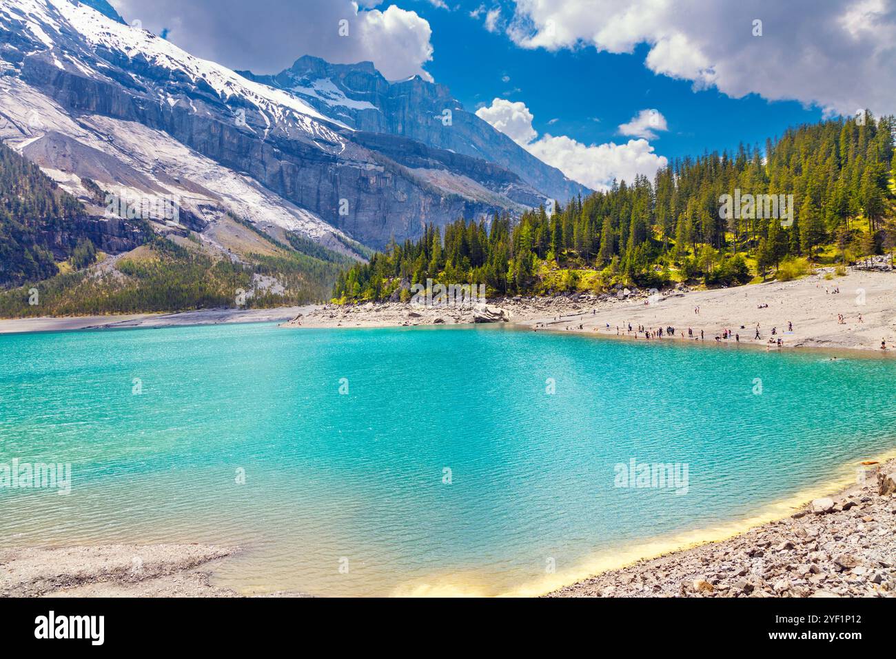 Scenic view of Oeschinen Lake (Oeschinensee) and Blüemlisalp mountain ...