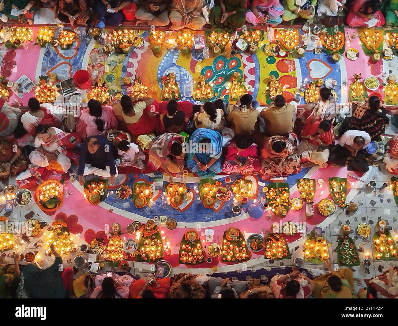 Dhaka, Bangladesh. 2nd Nov, 2024. Hindu devotees attend an earthen lamp light prayer session to ...