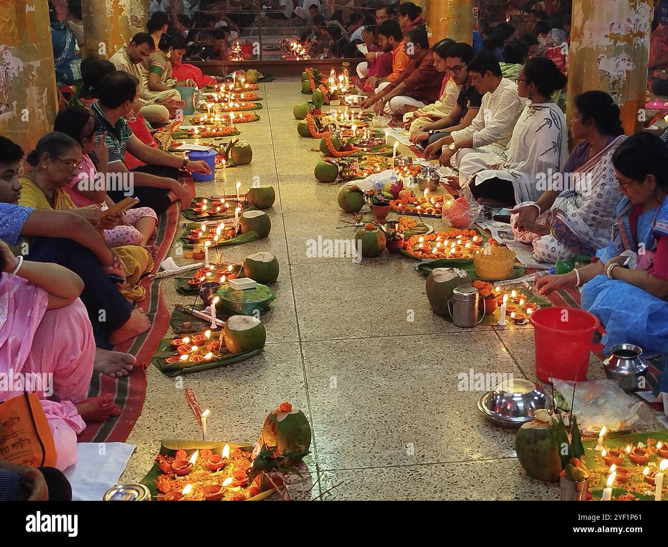 Dhaka, Bangladesh. 3rd Nov, 2024. Hindu devotees attend an earthen lamp light prayer session to ...