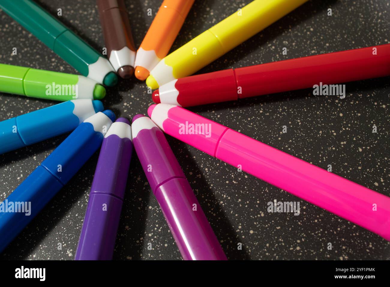 Iron pan with colorful markers inside. Top view, flat lay, minimal ...