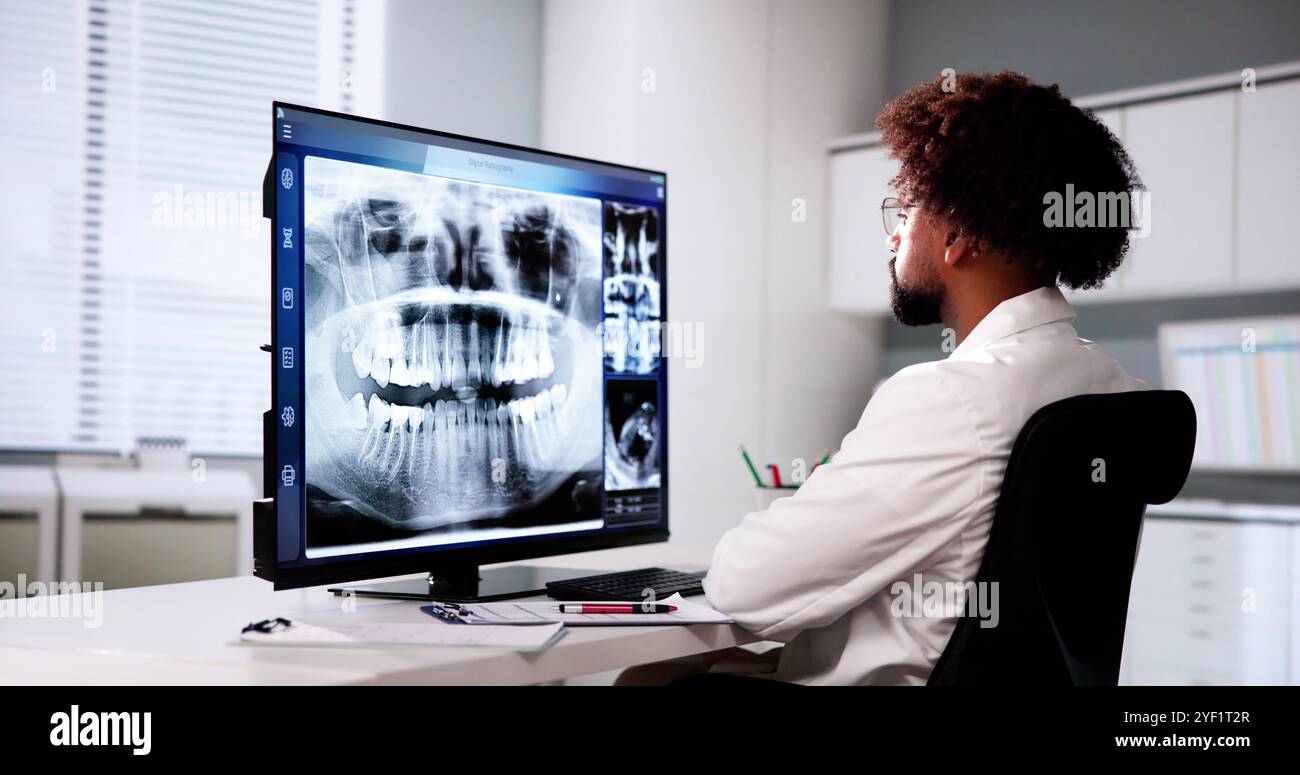 Male dentist using computer hi-res stock photography and images - Alamy