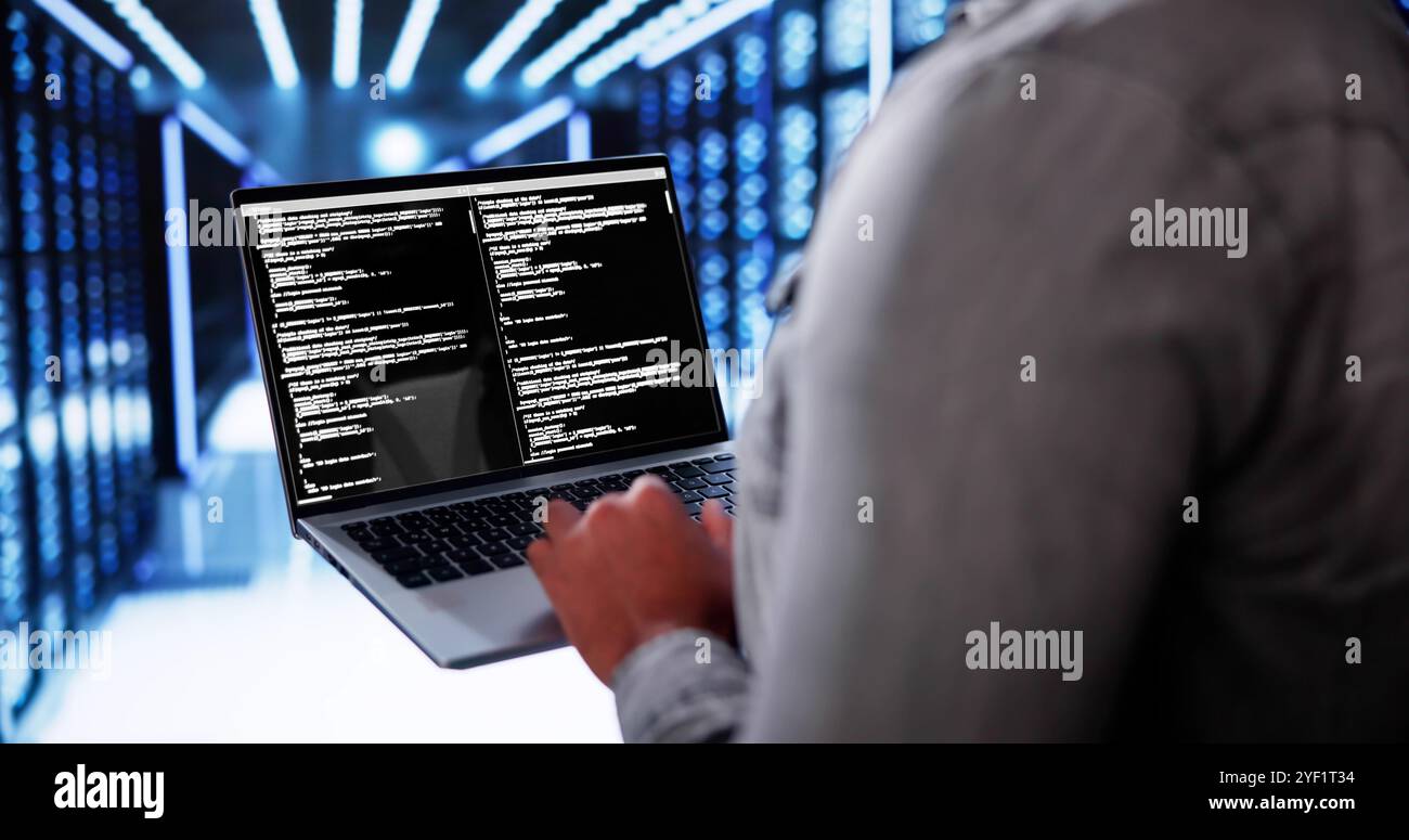Cloud Computer Engineer Coding In Server Room In Data Center