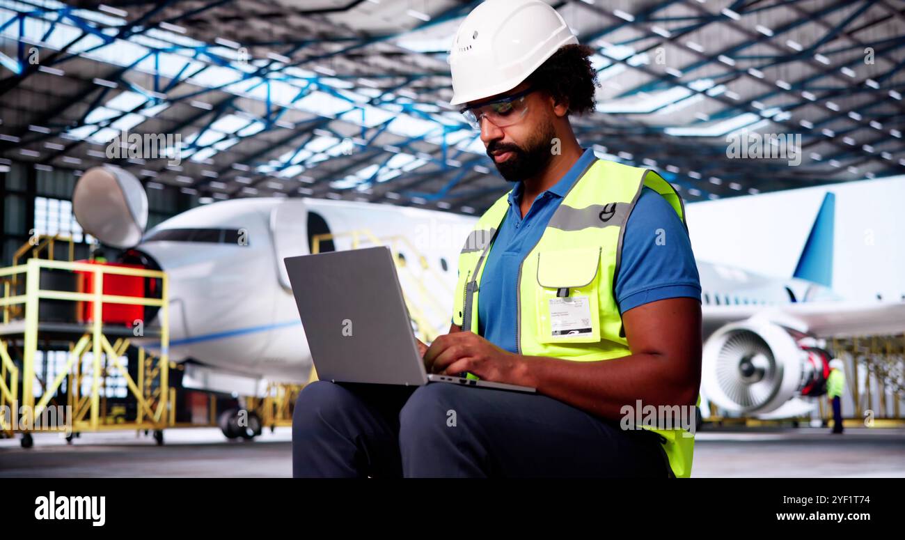 Aviation Aircraft Repair Technician Using Laptop To Check Plane Safety ...