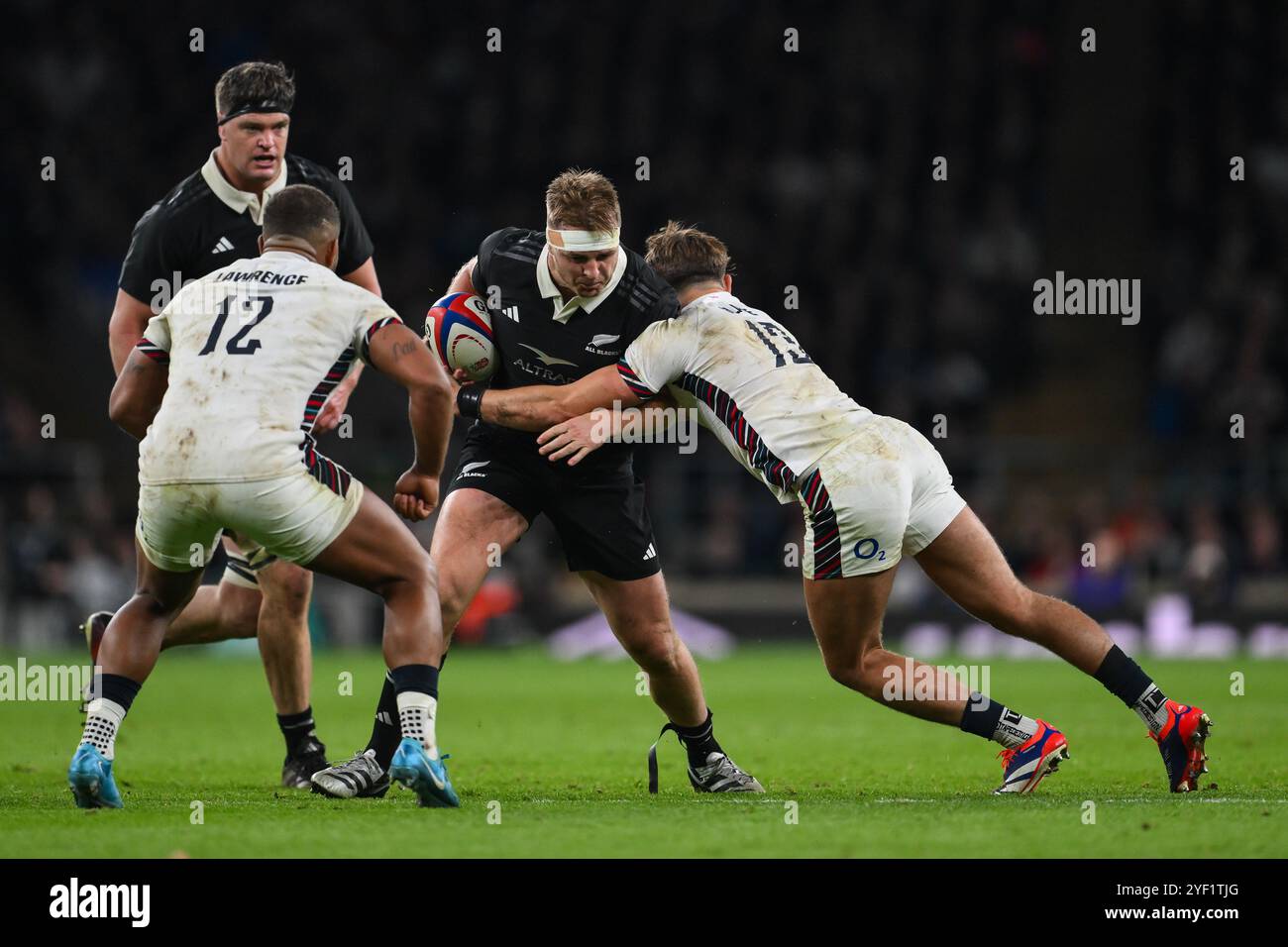 Sam Cane of New Zealand is tackled by Henry Slade of England during the ...