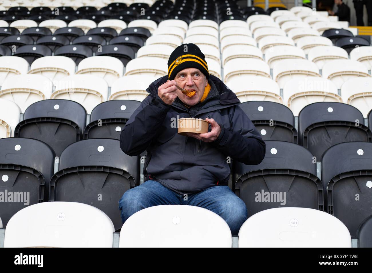 Kelvin Mawer ,71, tucks into his food box before kick-off . Kelvin has ...