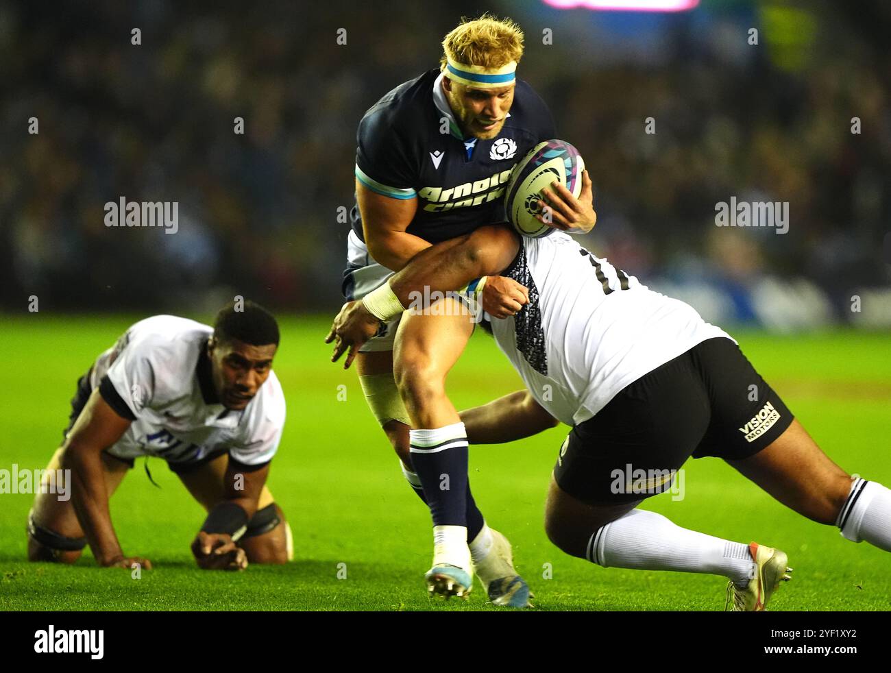 Scotland's Dylan Richardson is tackled during the Autumn international ...