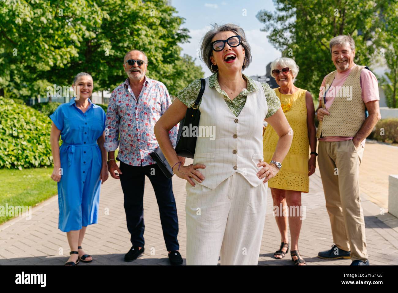 Group of senior friends meeting outdoors in the city and having fun ...